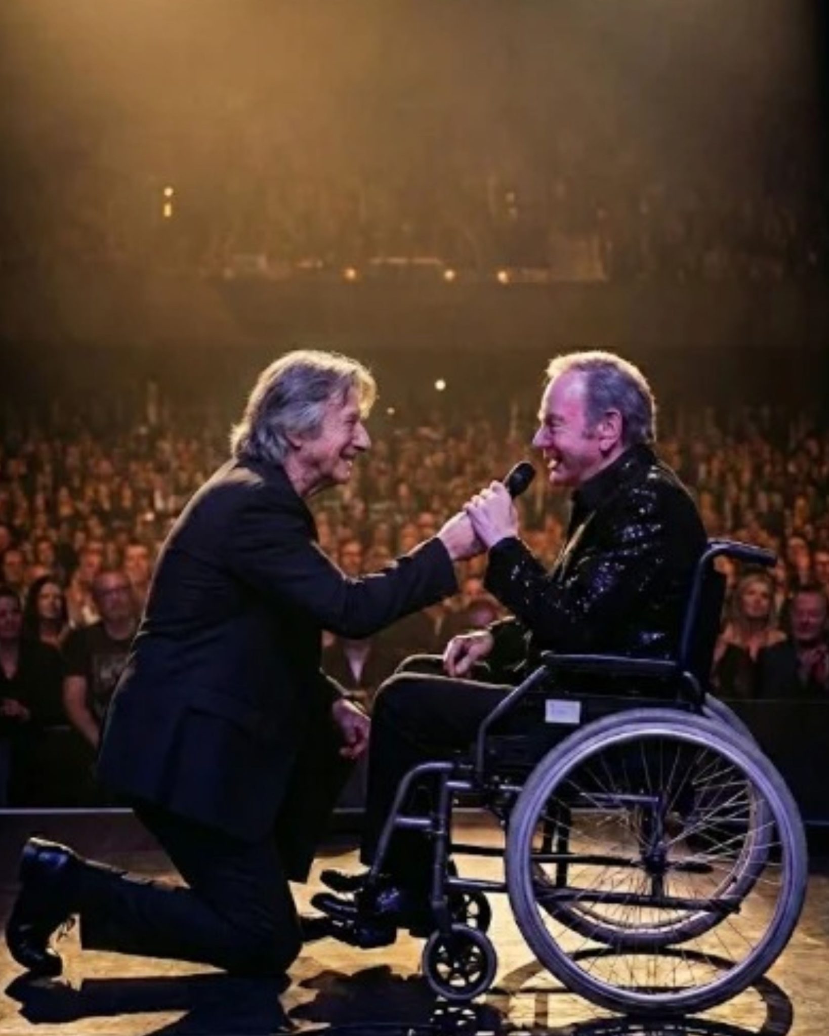 The room went quiet when Steve Perry stepped into the light beside Neil ...